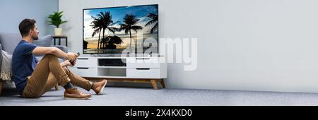 Man Watching Connected TV Screen In Living Room Stock Photo - Alamy