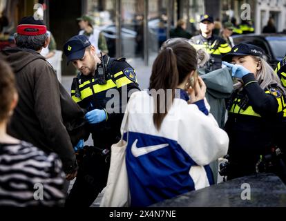 AMSTERDAM - Police check visitors to Dam Square prior to the National ...