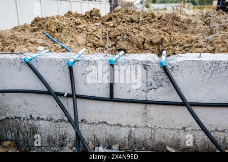 Pest control pipe system install at new house construction foundation ...