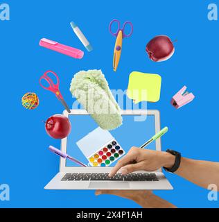 Different flying school supplies and laptop on green background Stock ...