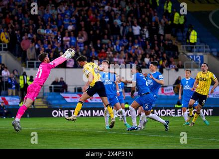 Peterborough United goalkeeper Jed Steer fails to stop Oxford United's ...
