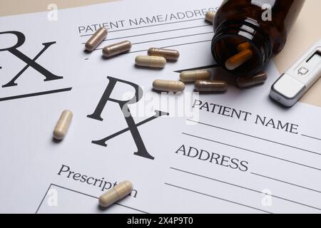 Medical prescription forms, pills and bottle on beige background ...