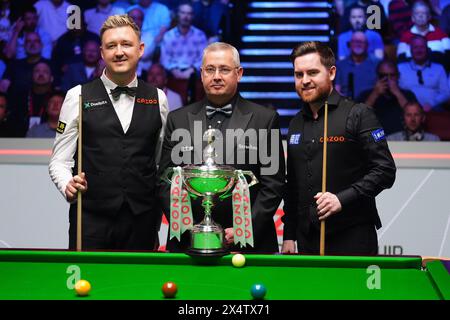 Jak Jones, Kyren Wilson and referee Paul Collier pose for a pre final ...