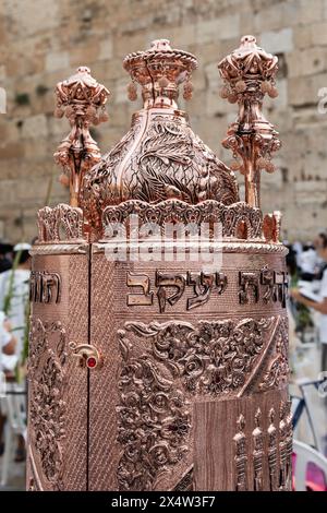 A decorative, Sephardic style Torah in a copper case designed with a ...