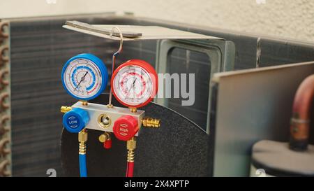 Close up of manifold meters used for checking air conditioner freon in ...