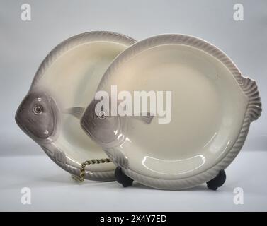 antique porcelain plates shaped like fish Stock Photo - Alamy