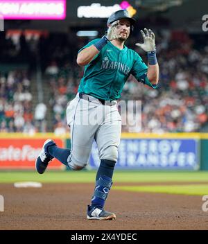 Seattle Mariners' Cal Raleigh rounds the bases after hitting a two-run ...