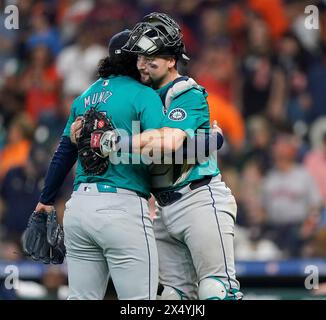 Seattle Mariners' Cal Raleigh (29) greets Luke Raley, right, after ...