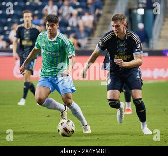 Seattle Sounders midfielder Obed Vargas, center, is greeted by forward ...