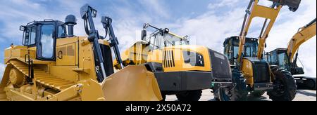 Fleet of yellow construction machines Stock Photo - Alamy