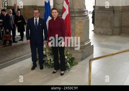 Finland's Prime Minister Petteri Orpo, left, poses under an umbrella with visiting European ...