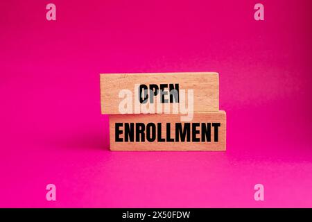 Open enrollment words written on ripped red paper with red background ...