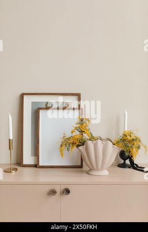 Vase with mimosa flowers on dining table in light room Stock Photo - Alamy