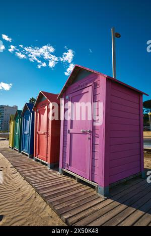 Brightly painted summer beach change rooms Stock Photo - Alamy