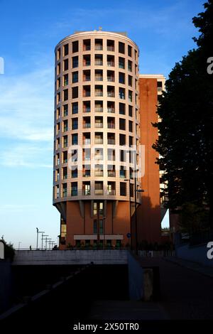 Modern cylindrical building captured at sunset Stock Photo - Alamy