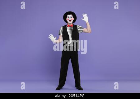 Mime artist making excited face on white background Stock Photo - Alamy