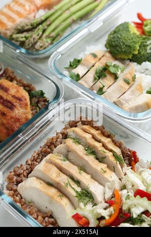 Healthy food. Different meals in glass containers on white background ...