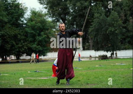Man dressed as Ukrainian warrior kozak training battle stick fight ...