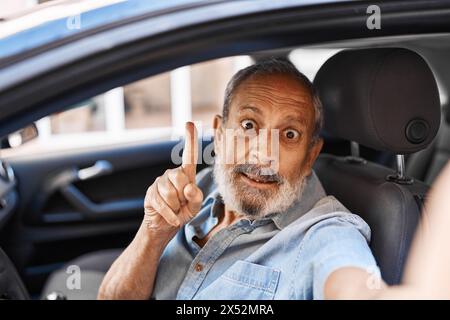 Photo of cheerful smart person beaming smile point finger brilliant ...