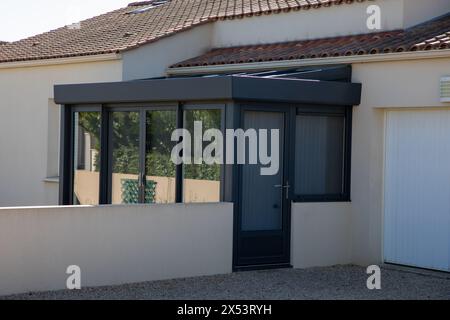 veranda glazed gallery grey against house modern facade entrance room ...