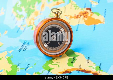 One compass on world map, space for text. Tourist equipment Stock Photo ...