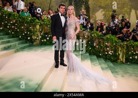 Gus Wenner and Elle Fanning arriving at the 83rd Annual Golden Globes ...