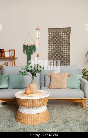 Interior of living room with wind chime, guitar and glucophone on ...