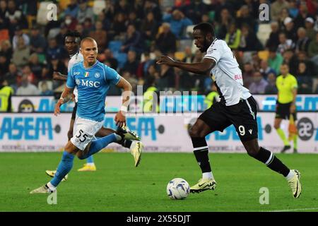 Udinese's Keinan Davis in action hindered by Lazio's Reda Belahyane ...