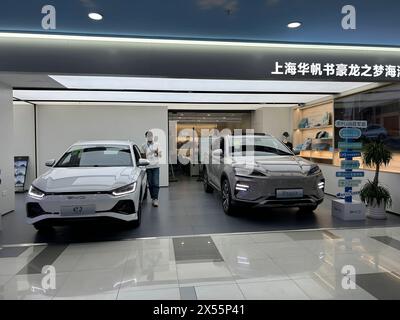 Electric cars in a BYD store. BYD is the leading electric vehicles ...