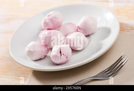 Goat cheese pearls with raspberries Stock Photo - Alamy