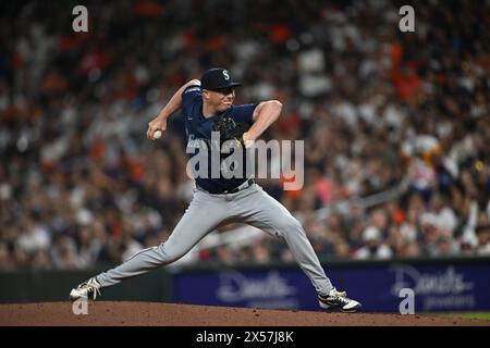 Seattle Mariners pitcher Trent Thornton goes to the ground with an ...