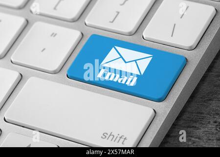 Light blue button with word Email and illustration of envelope on ...