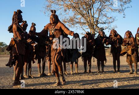 Traditional Himba woman clapping, music and dance, portraits, in the ...