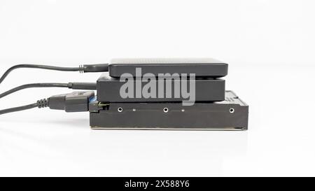 External hard disc drives connected to transfer files isolated on white ...
