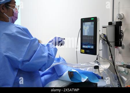 Nurse Watching Monitor while Administering Peripherally Inserted ...