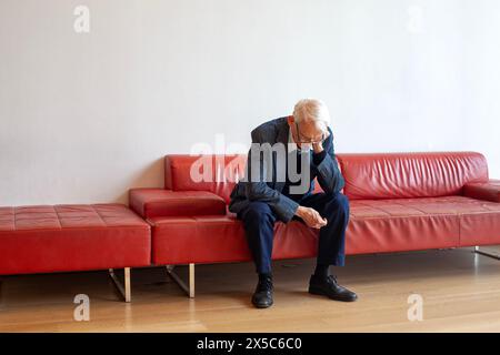 An upholstered bench provides a place for people to sit and ponder life ...