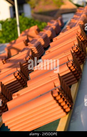 Red Clay single roll pan roof tiles laid out ready to be fitted on the ...