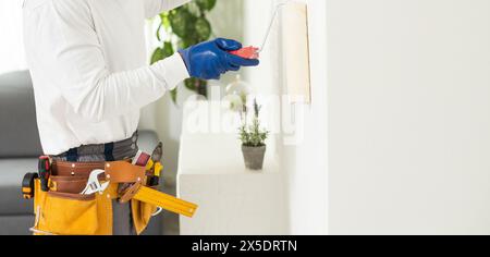 Male with belt full of hand instruments for repairing home Stock Photo ...