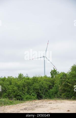 Wind tirbune on rainy day. eco energy concept Stock Photo - Alamy