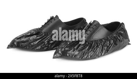 Men's shoes in black shoe covers isolated on white Stock Photo - Alamy