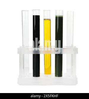 Test tubes with different types of crude oil on light grey table, space ...