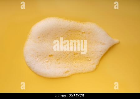 Sample of fluffy foam on yellow background, top view Stock Photo - Alamy