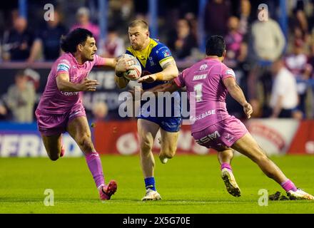 Warrington Wolves' Josh Thewlis (centre) celebrates with Rodrick Tai ...