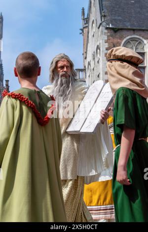 A man dressed as Mosses carries the ten commandments during the ...