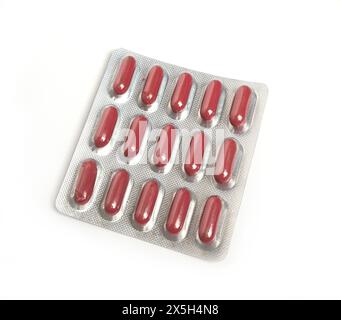 Red medical capsules. Capsules in a blister pack. Close-up Stock Photo ...