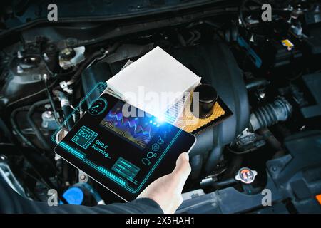 Car mechanic checking ECU electronic control unit with OBD or OBD2 ...