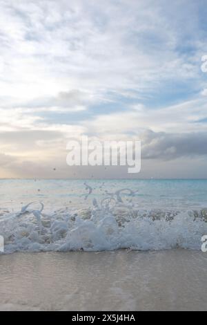 Close-up of small waves crashing on rocks. Creative. Stone beach with ...
