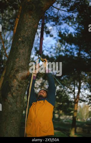 Athletic man trains on a slackline Stock Photo - Alamy