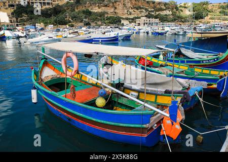 Gozo, Malta. Gozo boat marina, colorful luzzu boats in the bay ...