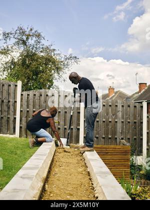 Couple doing yard work Stock Photo - Alamy